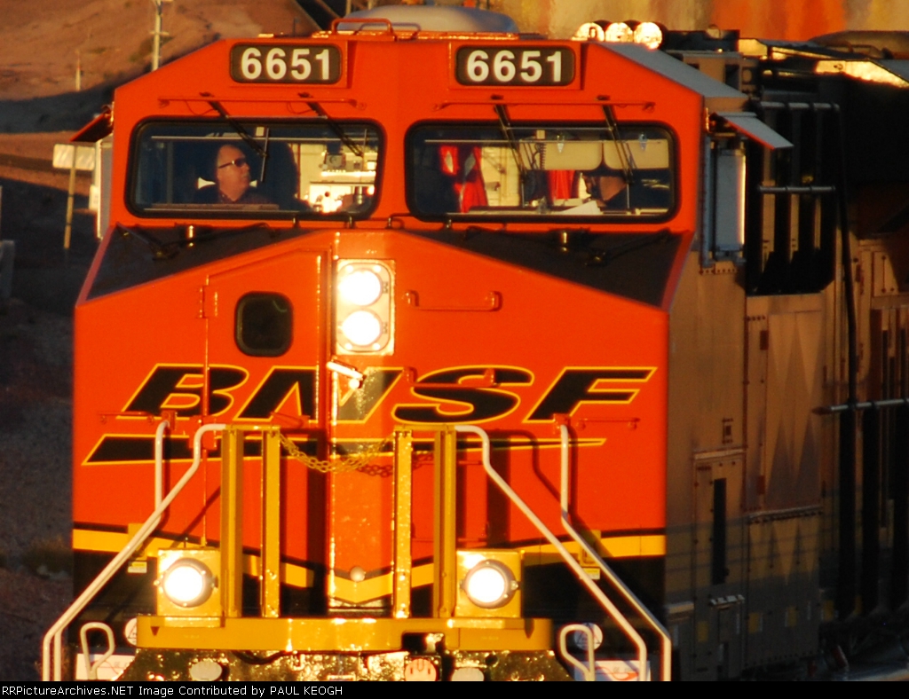 Up close shot of the crew of BNSF 6651 as they roll west into a California sunset.